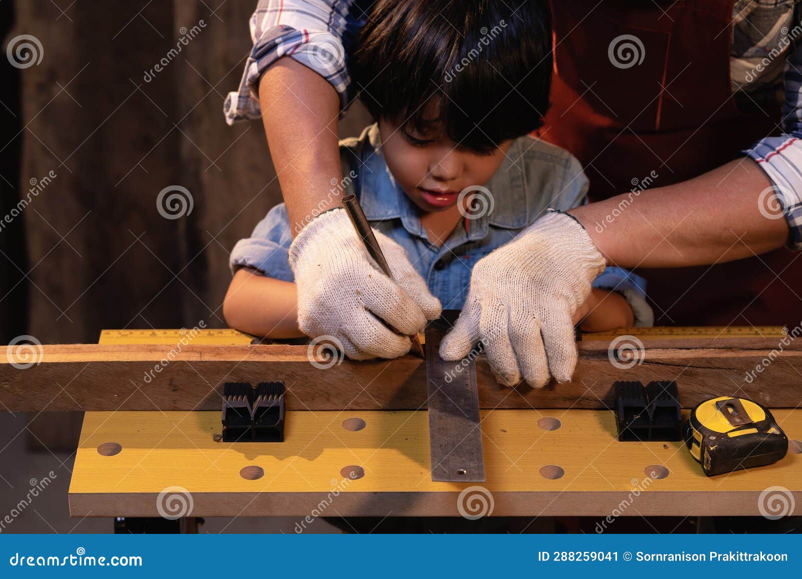 Carpenter Teaching Son To Practice Learning and Concentrated To Work ...