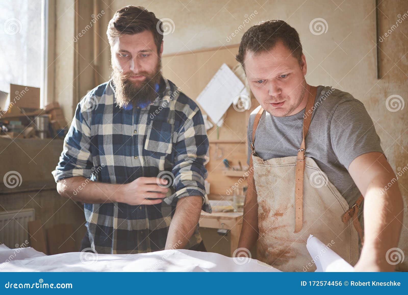 Carpenter Team Looks at an Architectural Drawing Stock Photo - Image of ...
