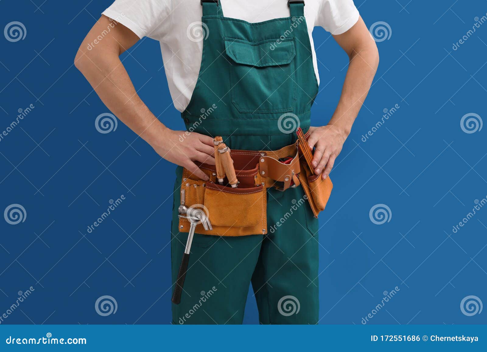 Carpenter with Tool Belt on Blue Background Stock Photo - Image of ...