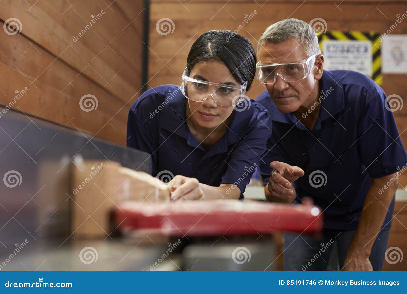 Carpenter Training Female Apprentice To Use Plane Stock Photo - Image ...