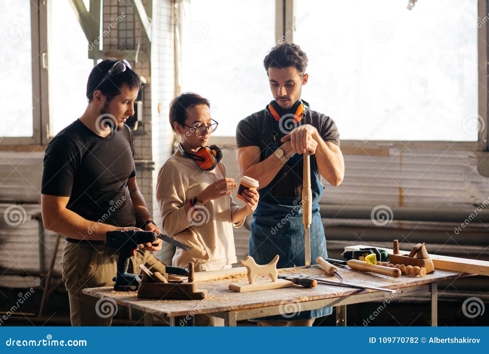 Carpenter Training Female Apprentice To Use Plane Stock Photo - Image ...