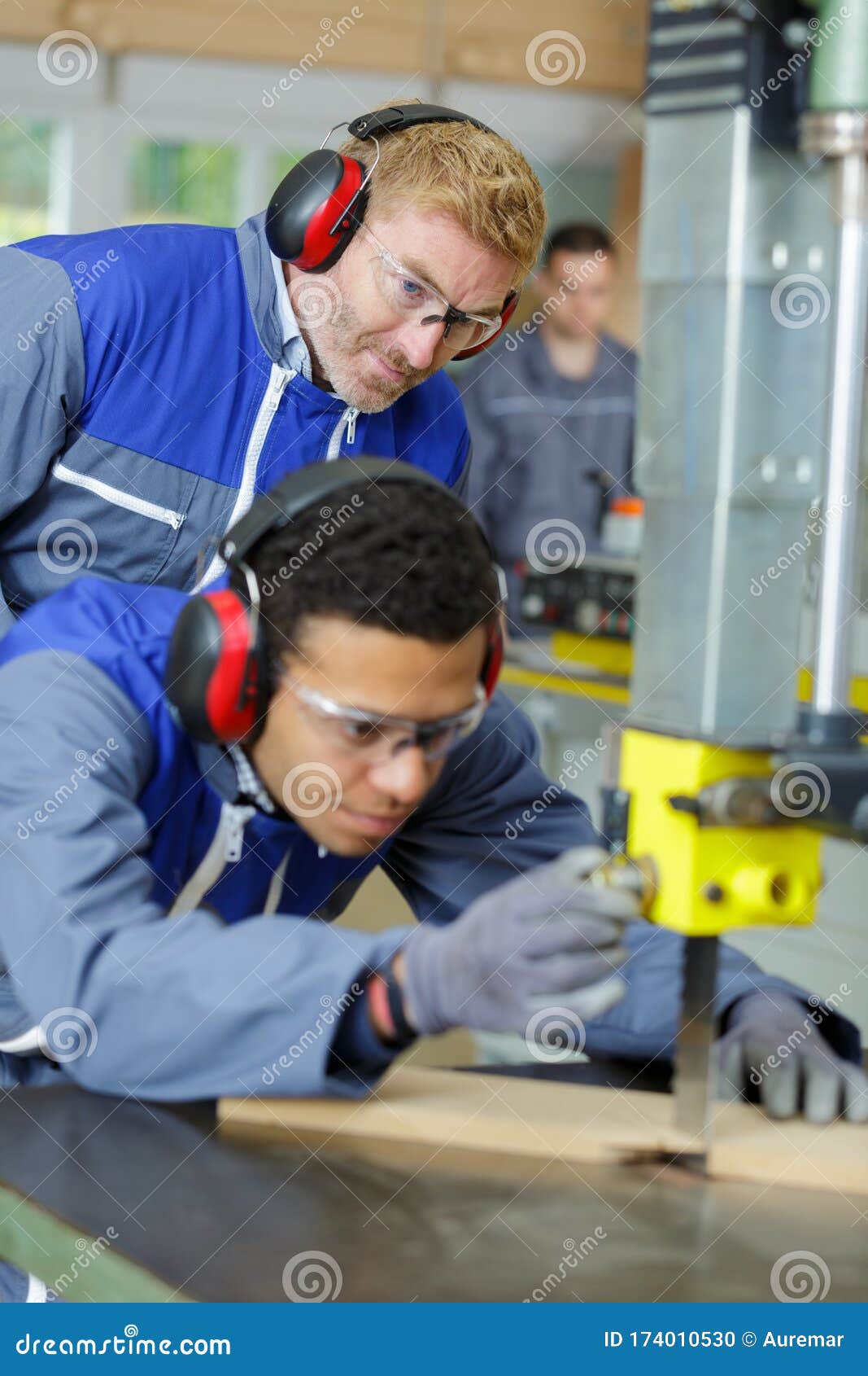 Carpenter Training Male Apprentice To Use Mechanized Saw Stock Photo ...