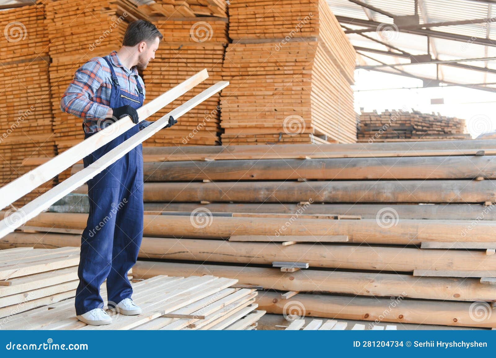 Carpenter in Uniform Check Boards on Sawmill Stock Photo - Image of ...