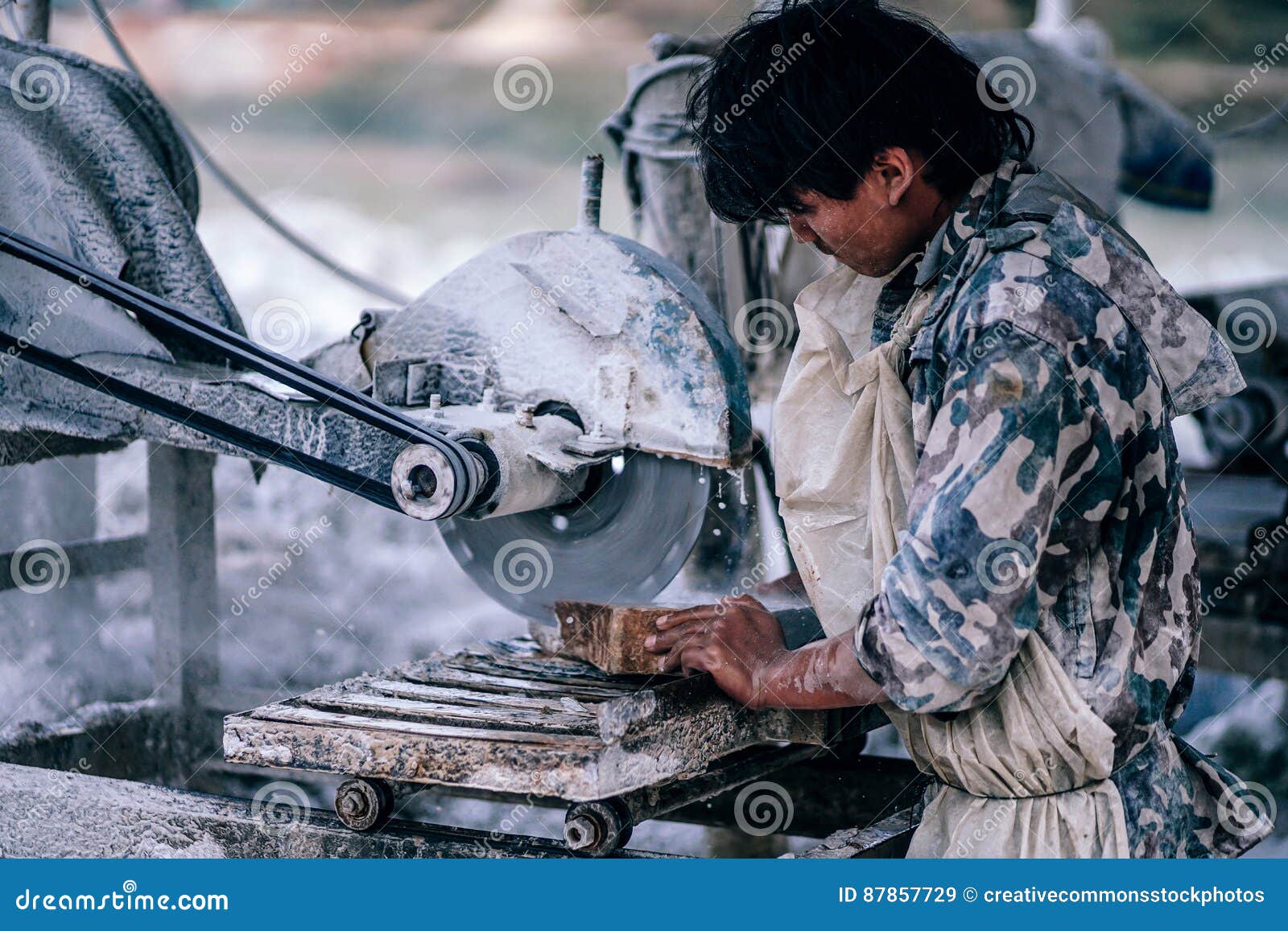 Carpenter In Uniform Cutting Wood Picture. Image: 87857729