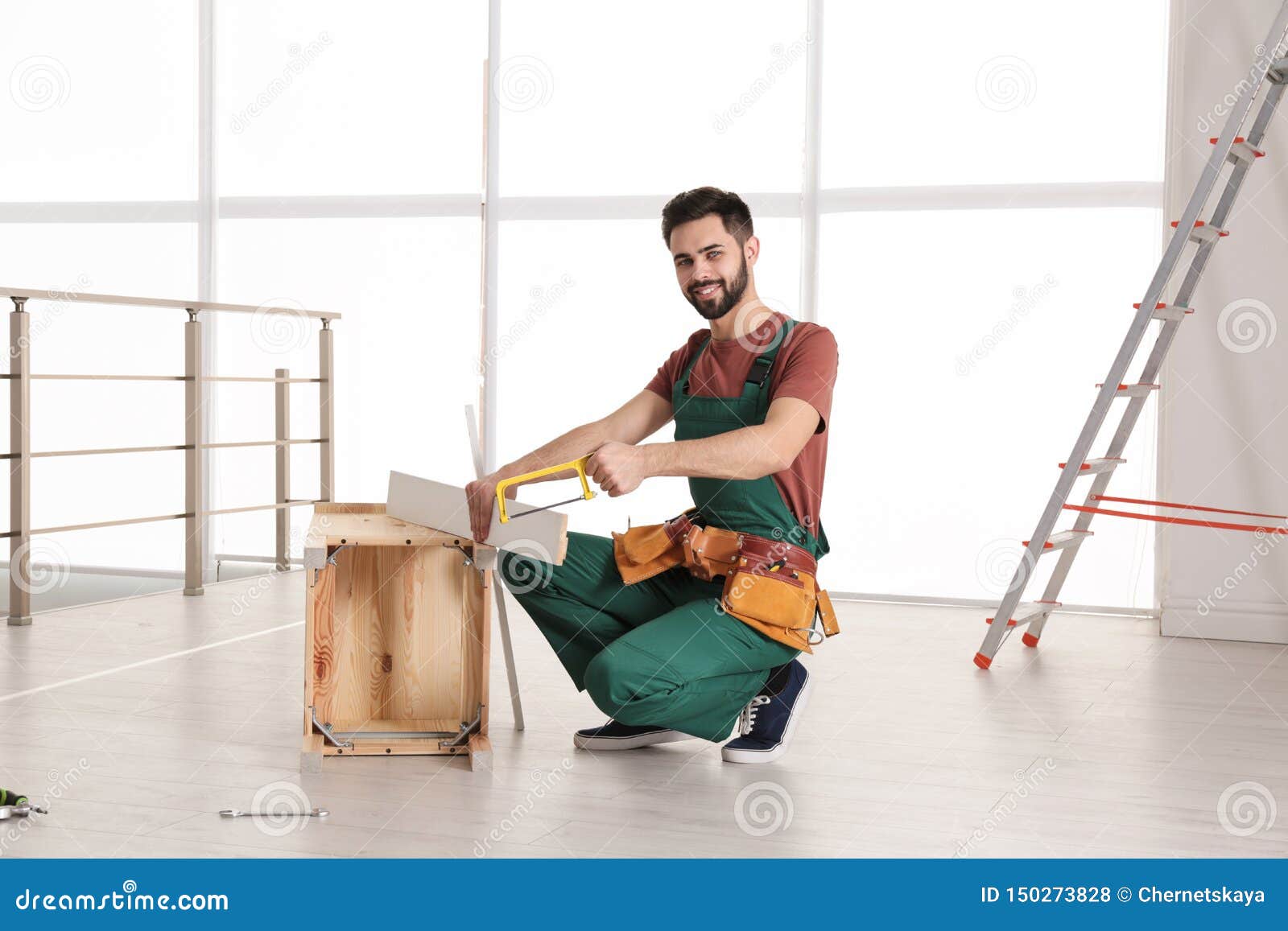 Carpenter in Uniform Making Furniture. Professional Construction Tools ...