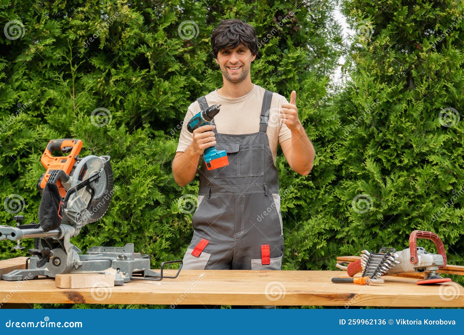 Carpenter Using Camcorder in Workshop. Caucasian Male Craftsperson with ...