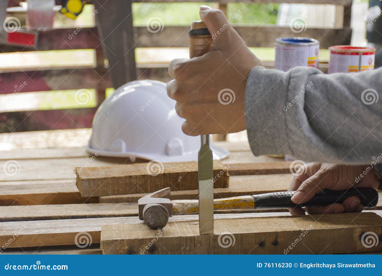 Carpenter Using Chisel and Hammer in His Hand with Plank.Close Up Stock ...