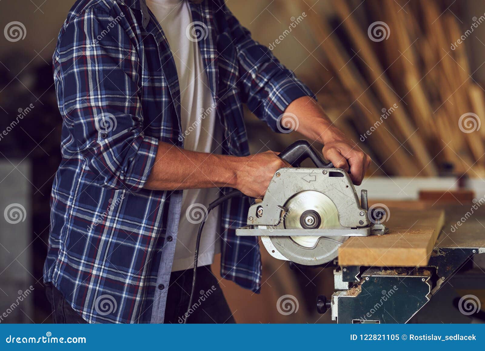 The Carpenter Using Circular Saw for Cutting Wooden Board Stock Image ...