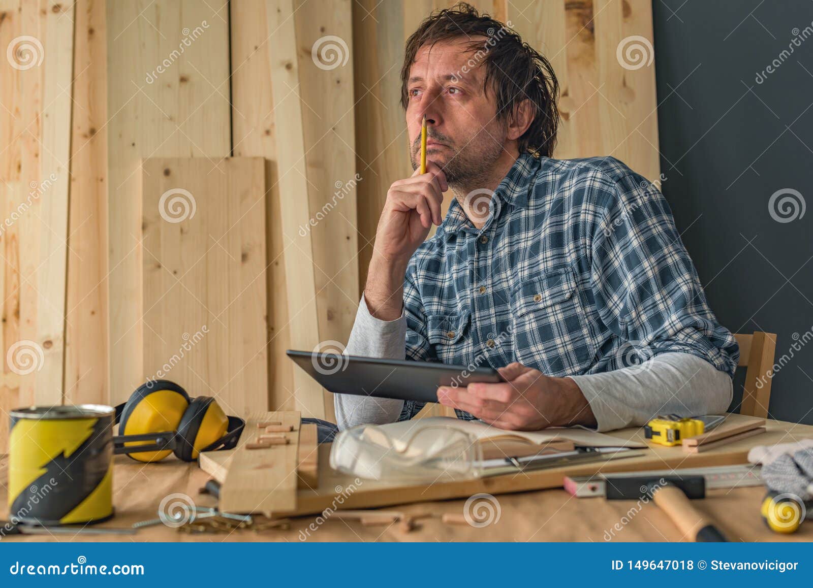Carpenter Using Digital Tablet in Small Business Woodwork Workshop ...