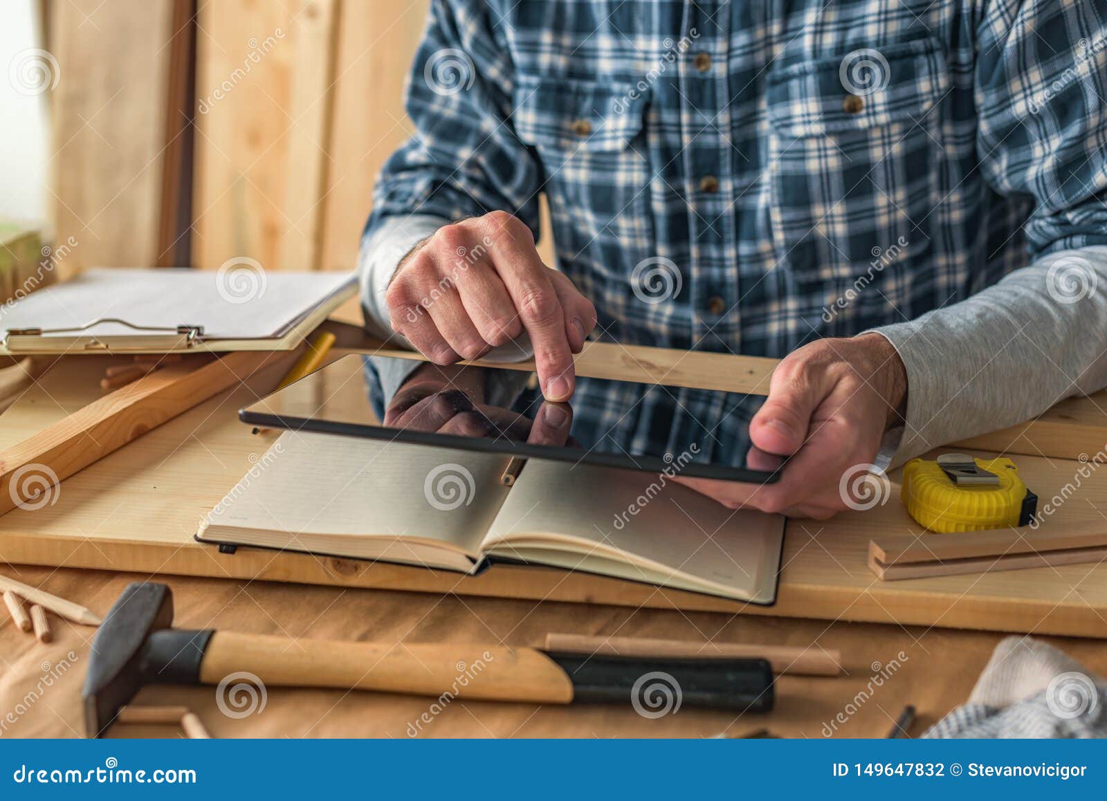 A Carpenter Using A Level Tool While Working On Wooden Structure In A ...