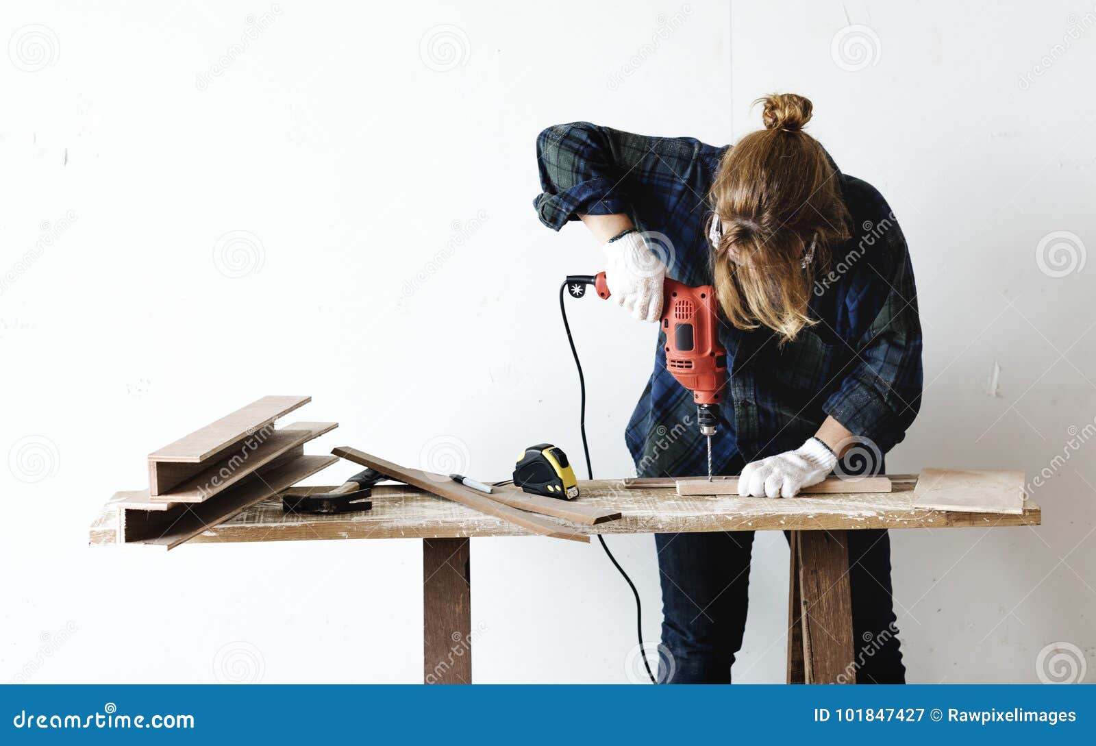 A Carpenter Using A Level Tool While Working On Wooden Structure In A ...