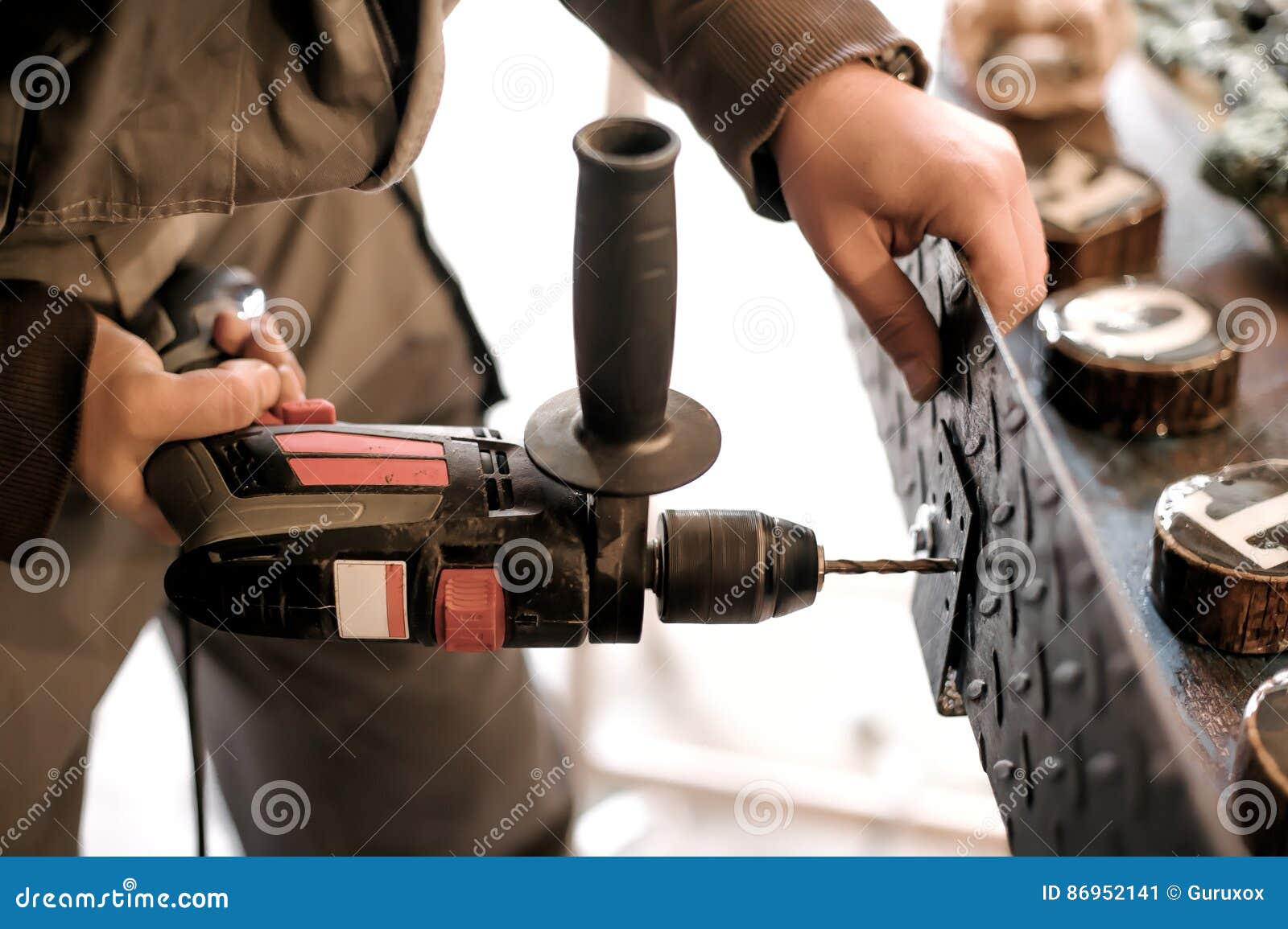 Carpenter Using Electric Drill for His Job in Carpentry Workshop Stock ...