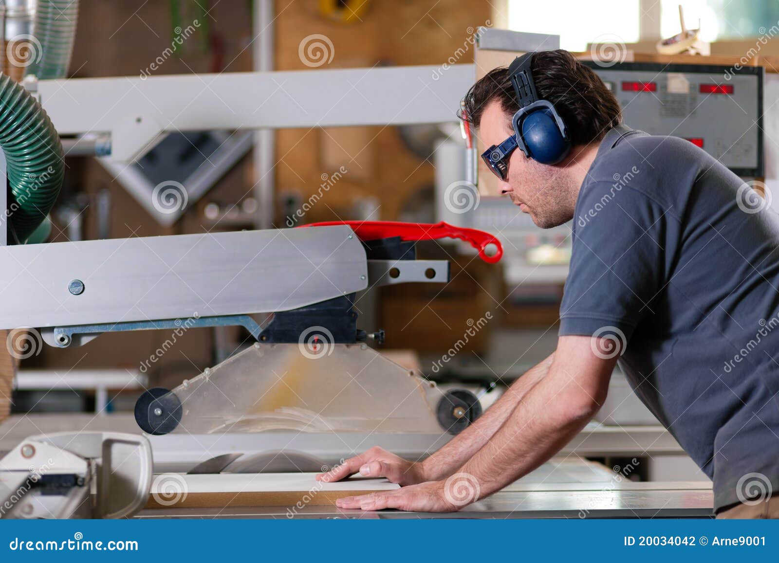 Carpenter Using Electric Saw Stock Photo - Image of safety, people ...