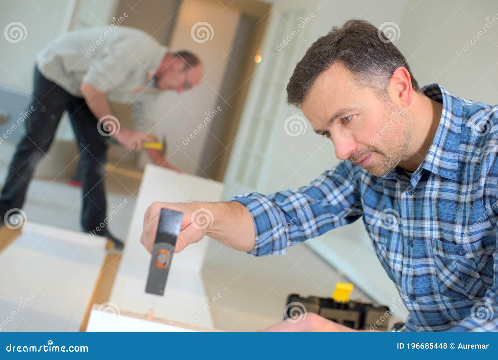 Carpenter using a hammer stock photo. Image of occupation - 196685448