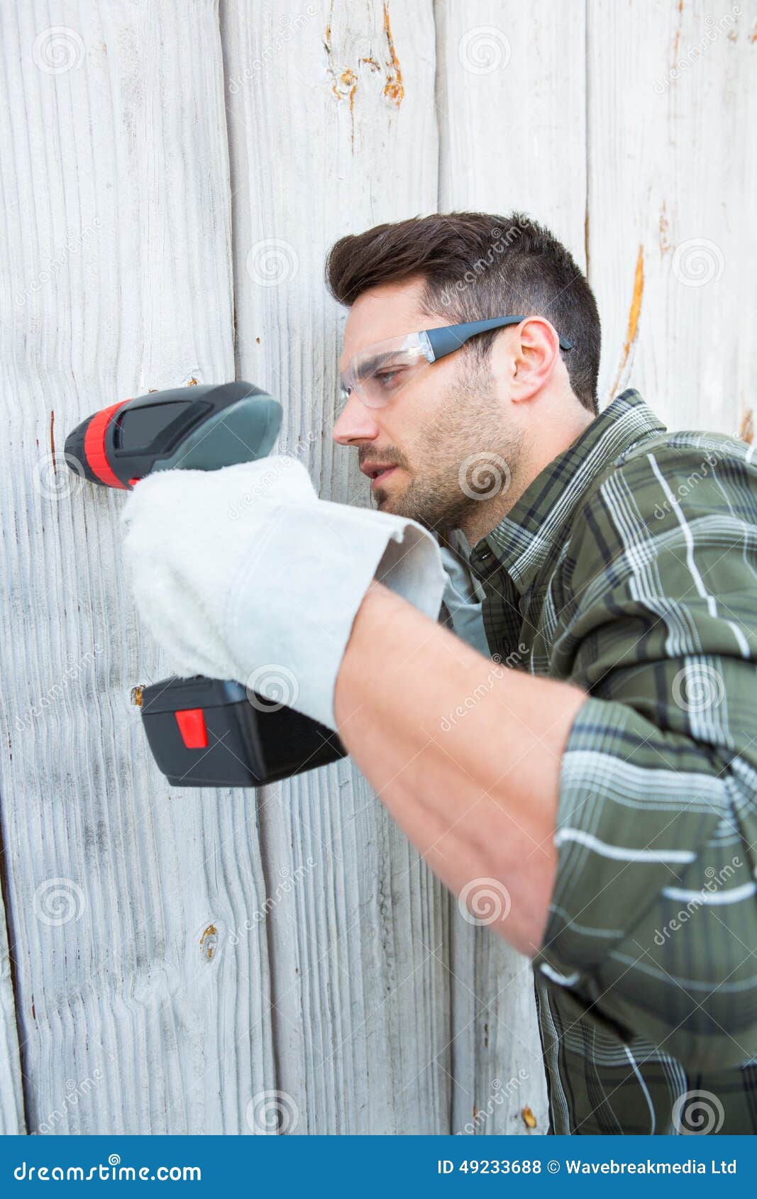 Carpenter Using Hand Drill on Wooden Cabin Stock Photo - Image of ...