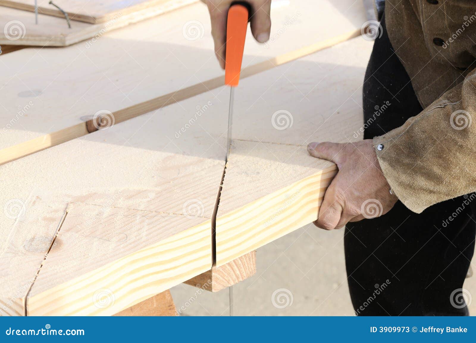 Carpenter Using Hand Saw Stock Photos - Image: 3909973