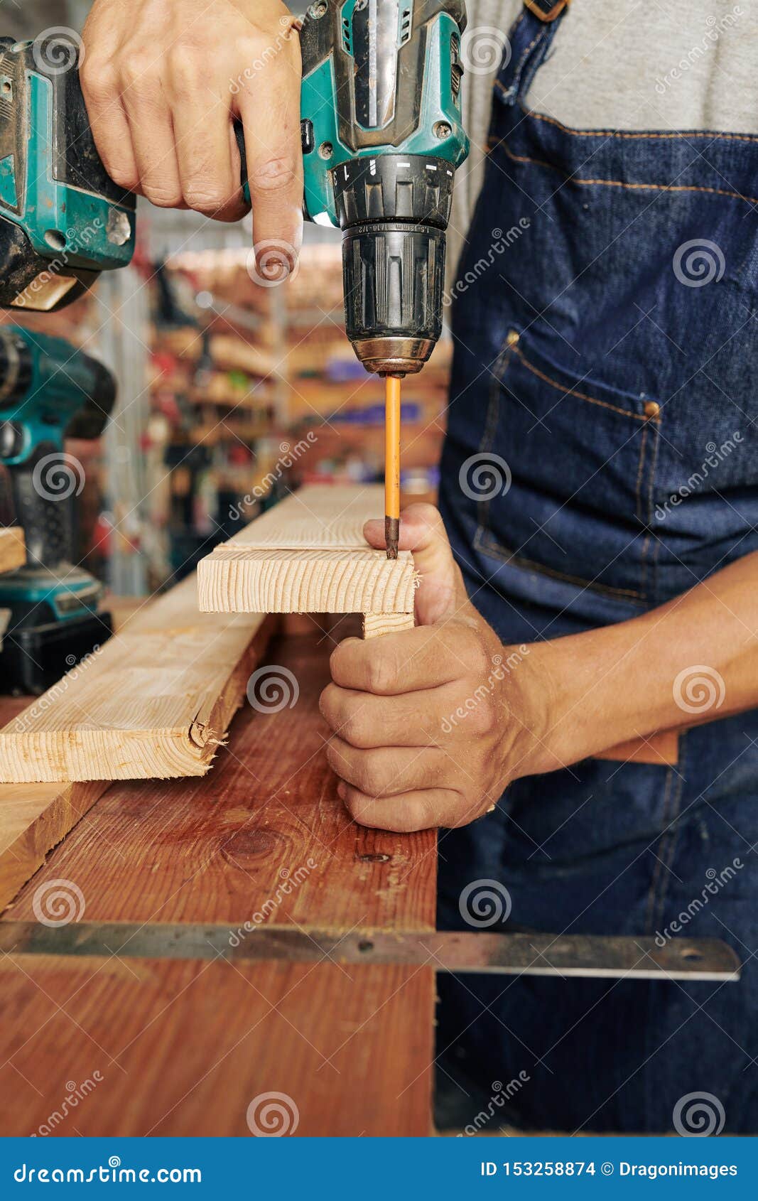 Carpenter Using Long Drill Bit at Work Stock Photo - Image of carpentry ...