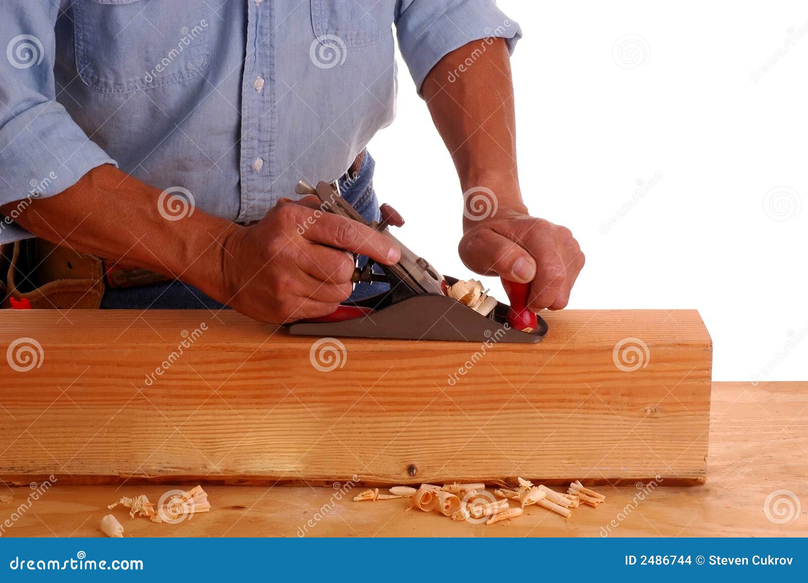 Carpenter using plane stock photo. Image of tools, jeans - 2486744