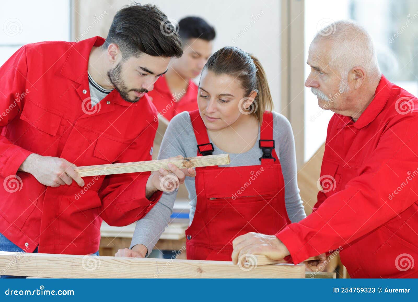 Carpenter with Woman and Man Apprentice in Workshop Stock Image - Image ...
