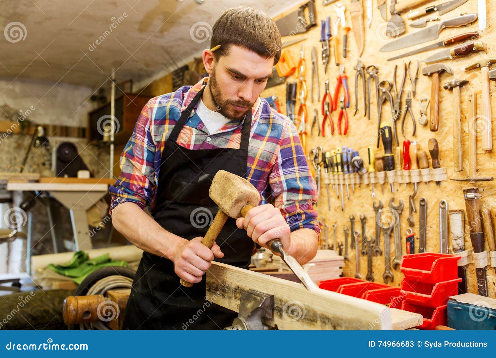 Carpenter with Wood, Hammer and Chisel at Workshop Stock Image - Image ...