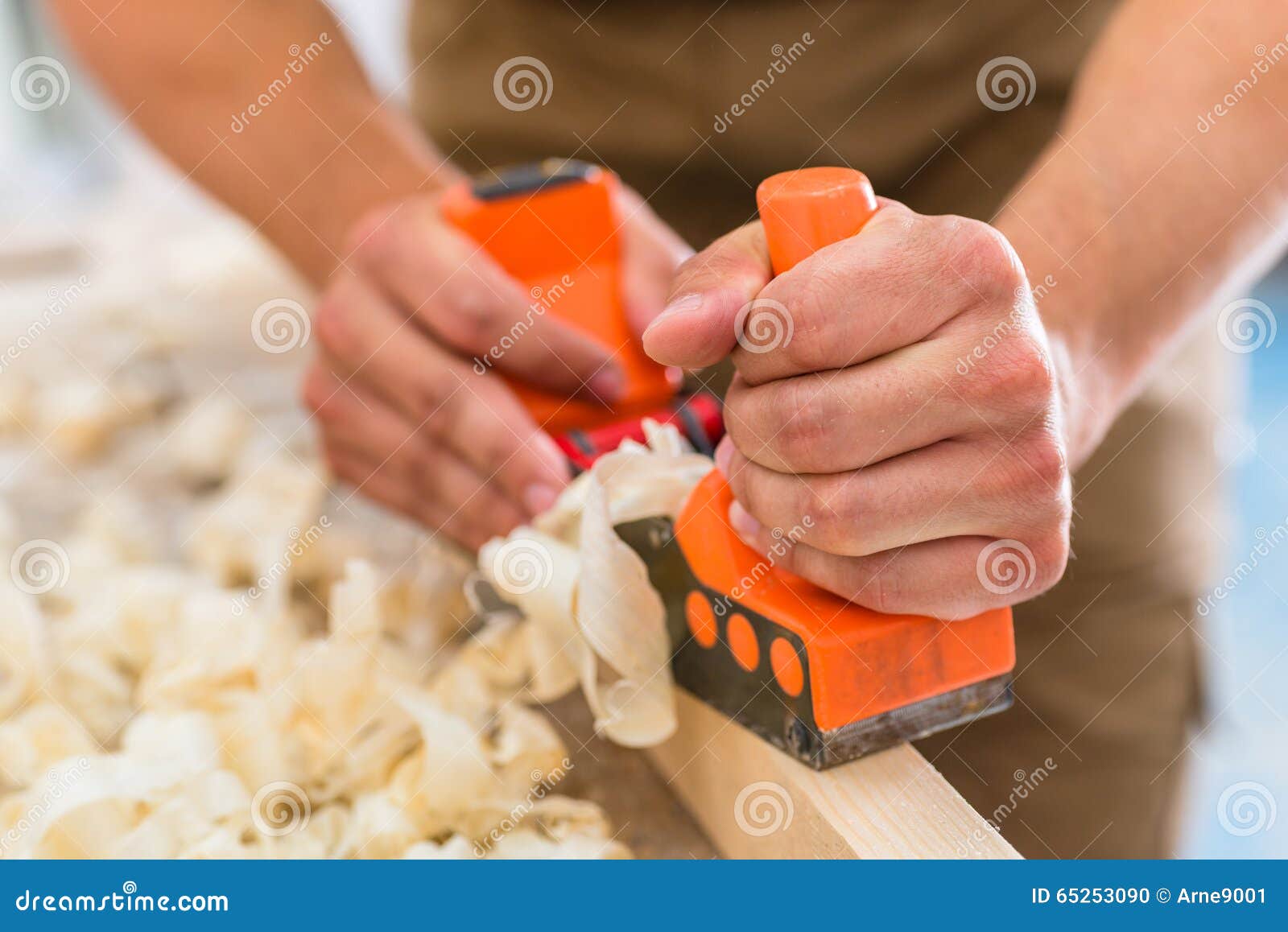 Carpenter with Wood Planer Working on Piece Stock Photo - Image of ...