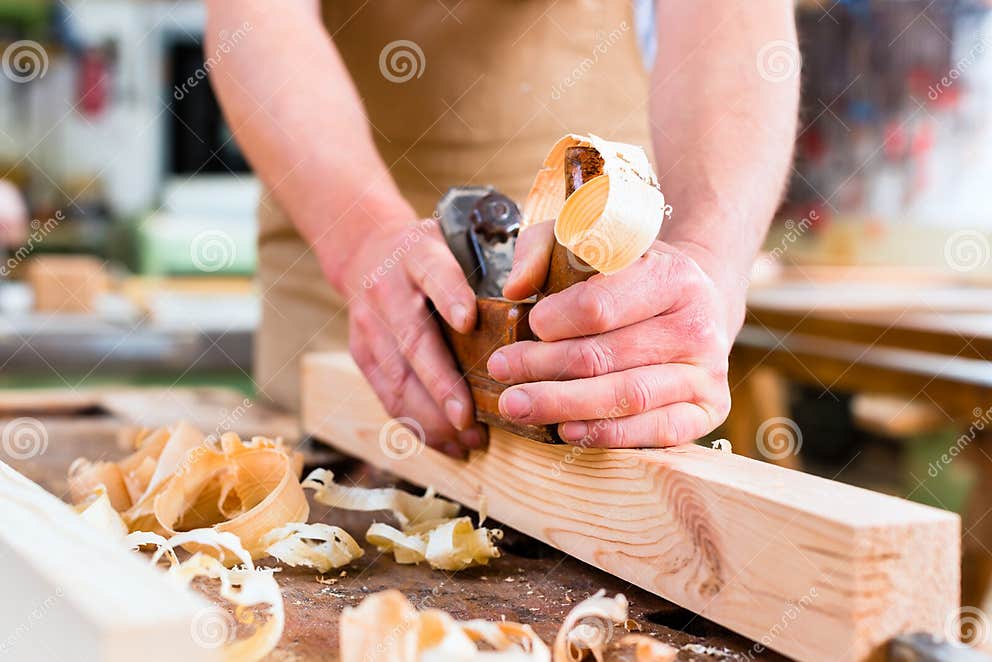 Carpenter with Wood Planer and Workpiece in Carpentry Stock Photo ...