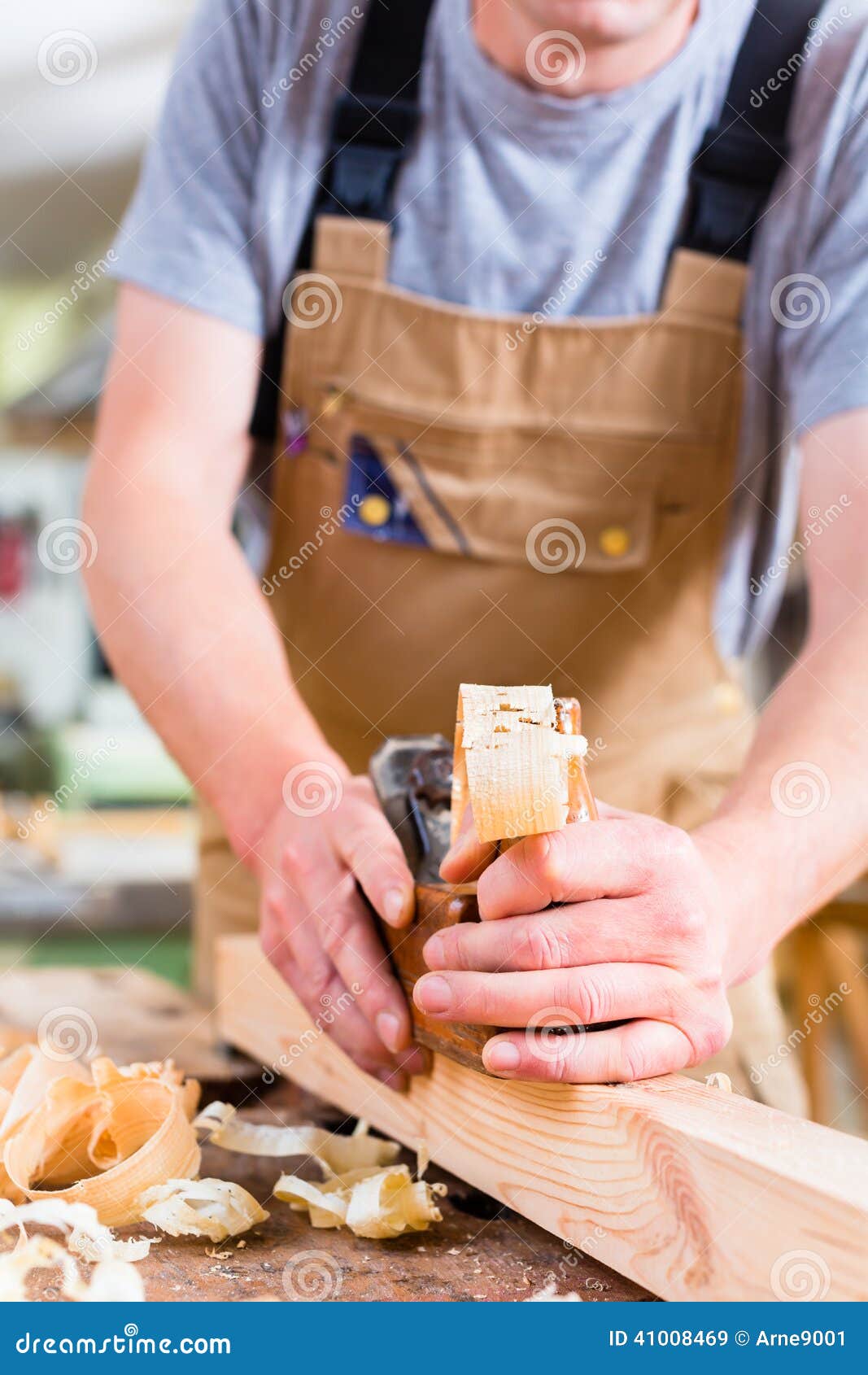Carpenter with Wood Planer and Workpiece in Carpentry Stock Image ...