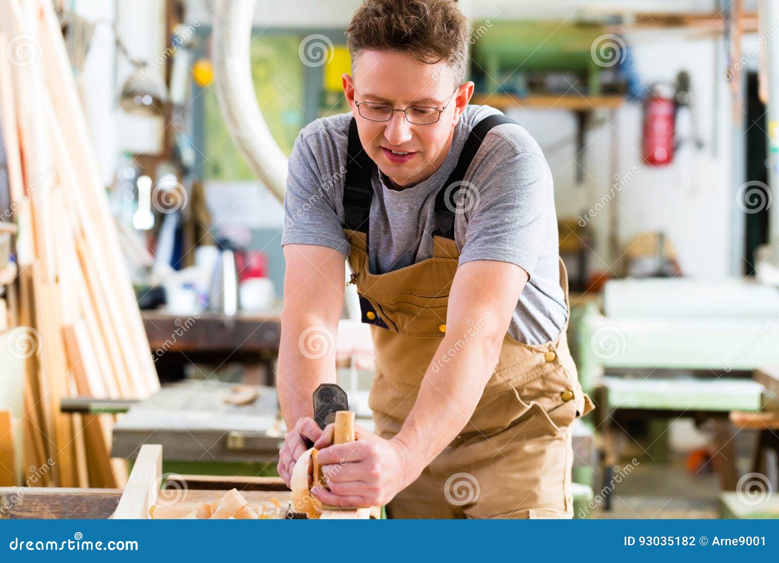 Carpenter with Wood Planer and Workpiece in Carpentry Stock Photo ...