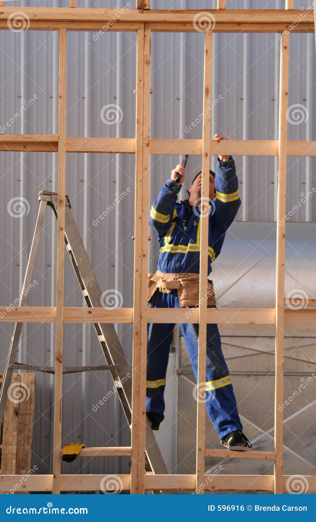 Carpenter at Work stock photo. Image of apron, construction - 596916