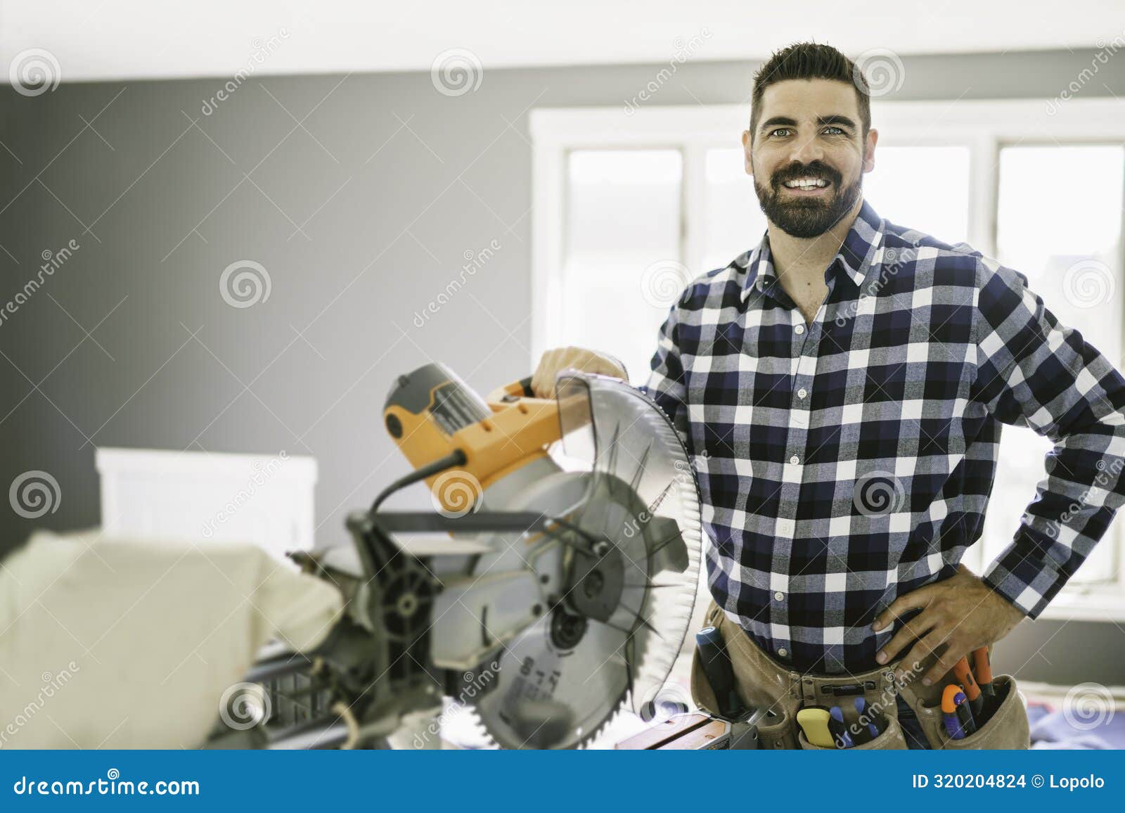 Carpenter at Work on Job Using Power Tool Stock Photo - Image of action ...