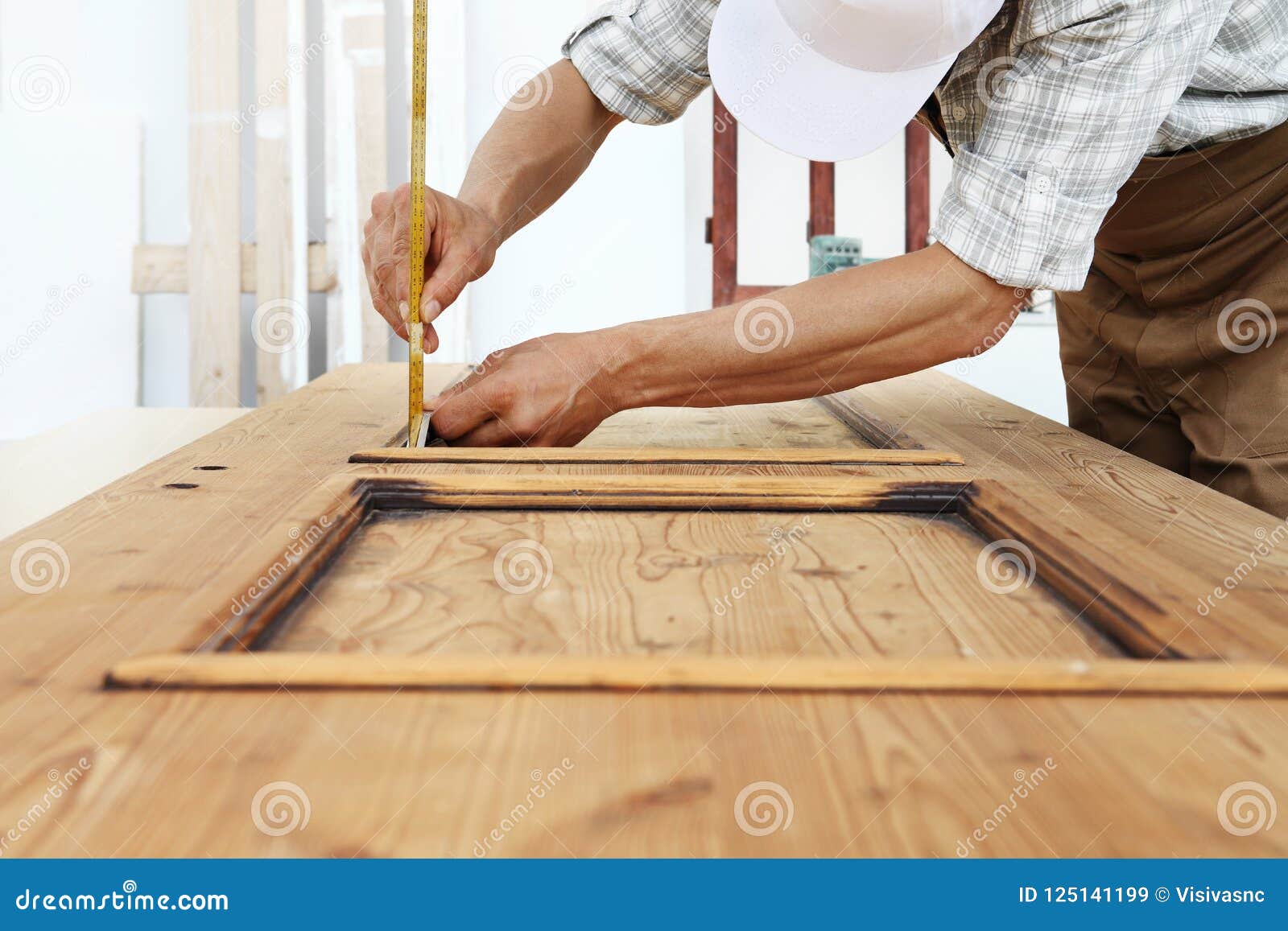 Carpenter Work the Wood, Measuring a Thickness with Angle Square Stock ...