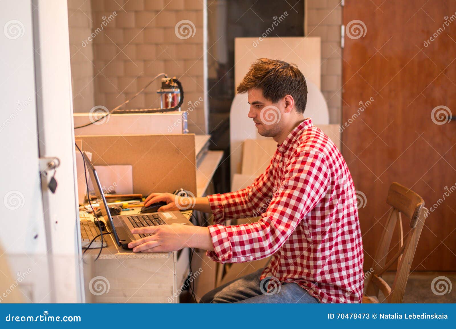 Carpenter Worker Prepares a Computer Program Software for CNC Ma Stock ...