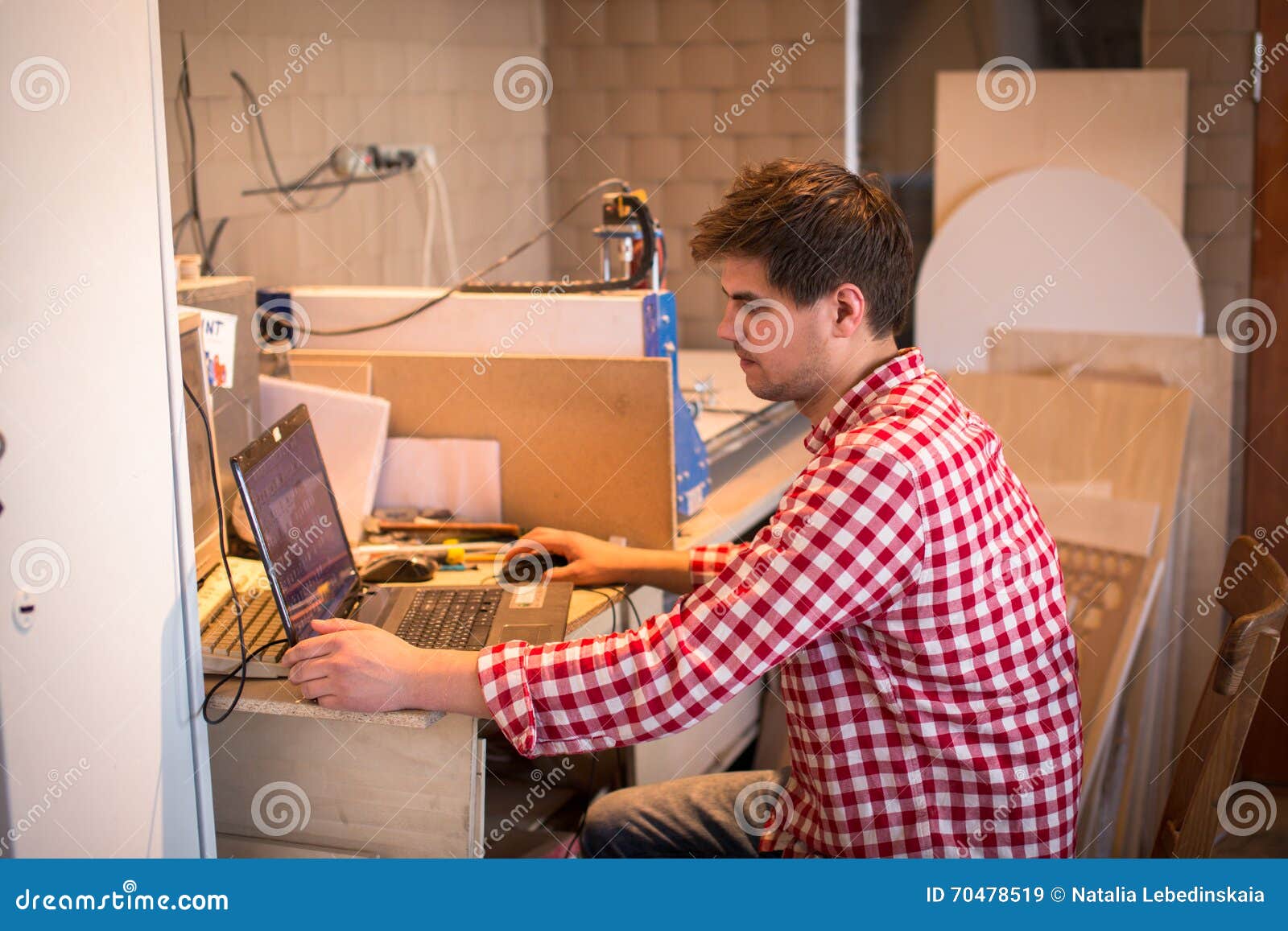 Carpenter Worker Prepares a Computer Program Software for CNC Ma Stock ...