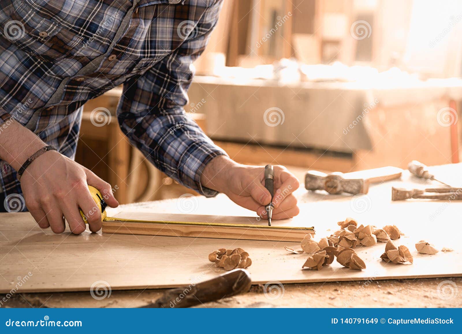 Carpenter Working with Meter or Rule Taking Measures on Wood. Workshop ...