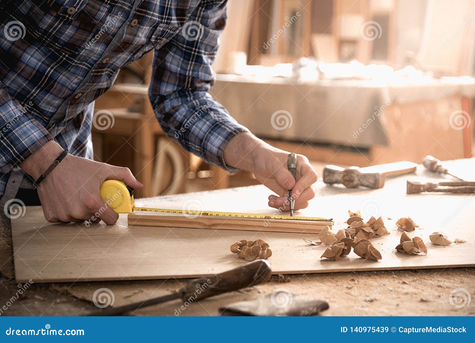Carpenter Working With Meter Or Rule Taking Measures On Wood Using ...