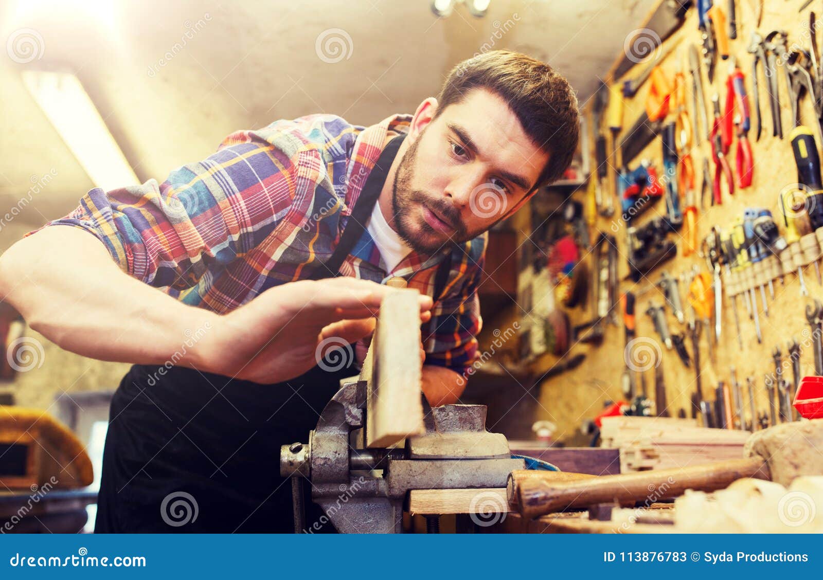 Carpenter Working with Plane and Wood at Workshop Stock Image - Image ...