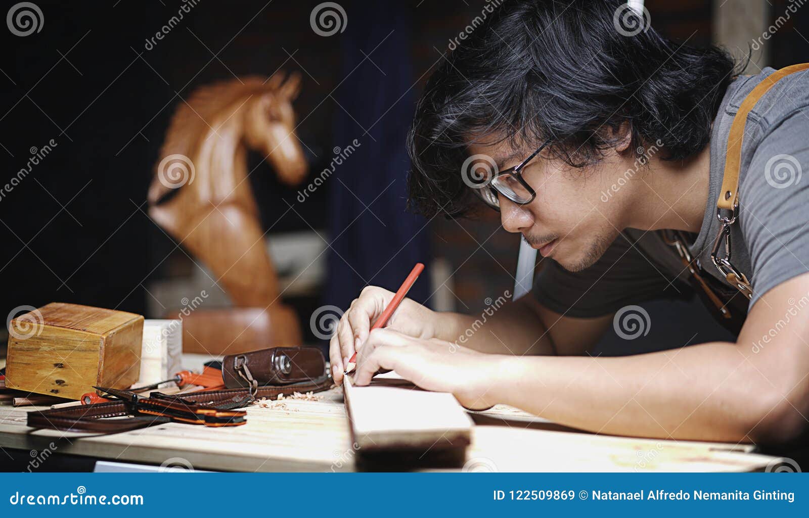Carpenter Working in Woodworking Workshop. Making Line with Rule Stock ...