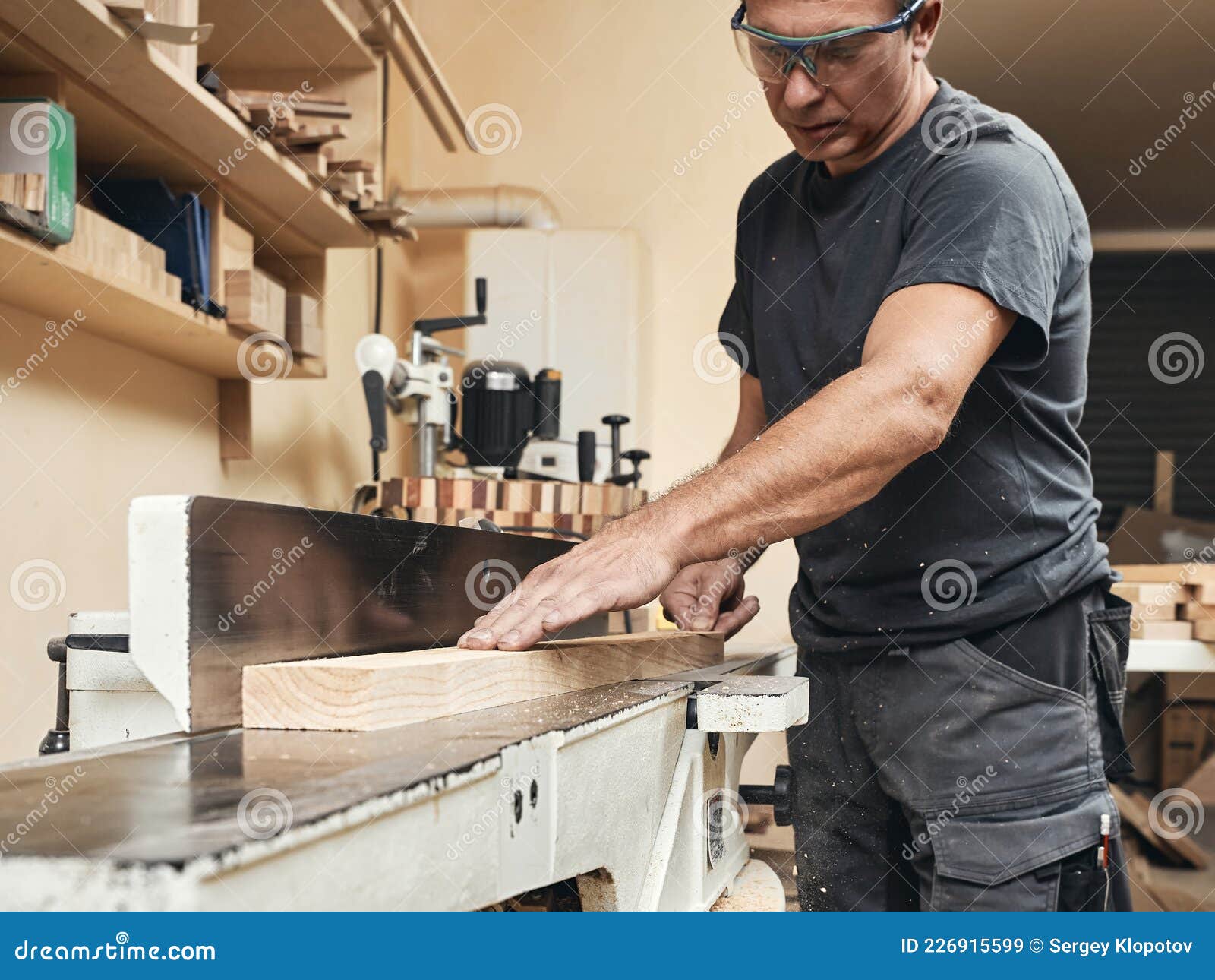 A Carpenter Works on a Board Sanding Machine Stock Image - Image of ...