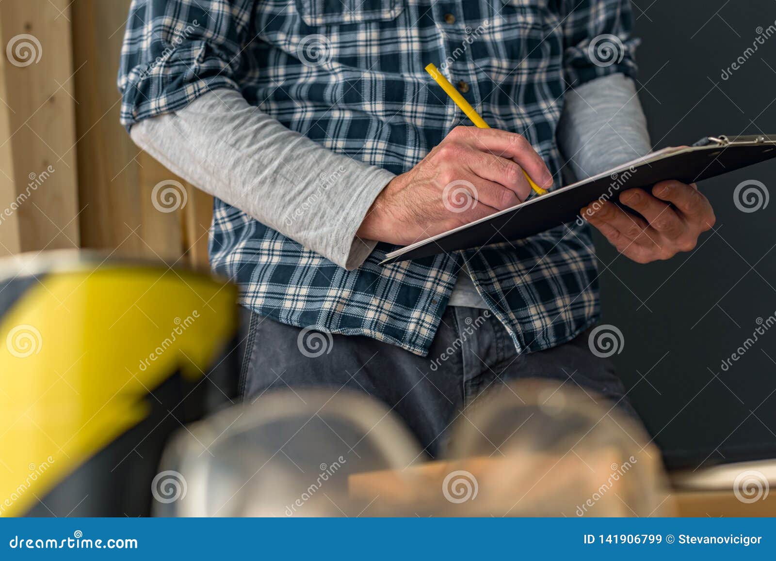 Carpenter Writing Notes on Clipboard Notepad Stock Image - Image of ...