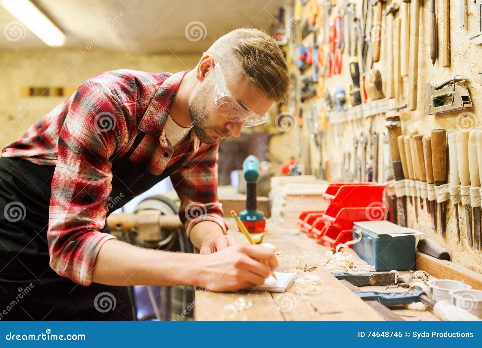 Carpenter Writing To Notebook at Workshop Stock Photo - Image of ...