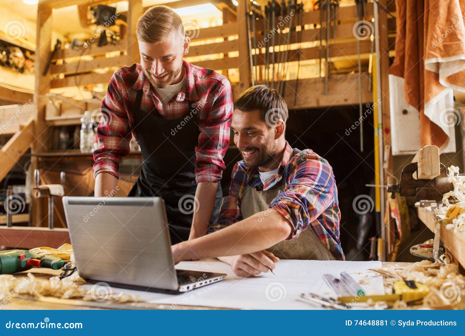 Carpenters with Laptop and Blueprint at Workshop Stock Image - Image of ...