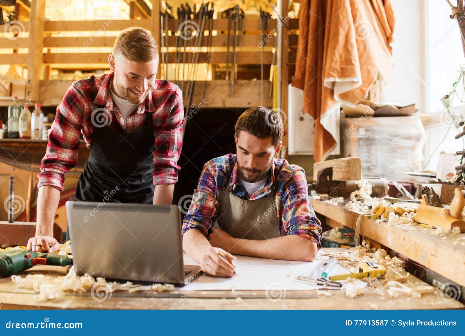 Carpenters with Laptop and Blueprint at Workshop Stock Image - Image of ...