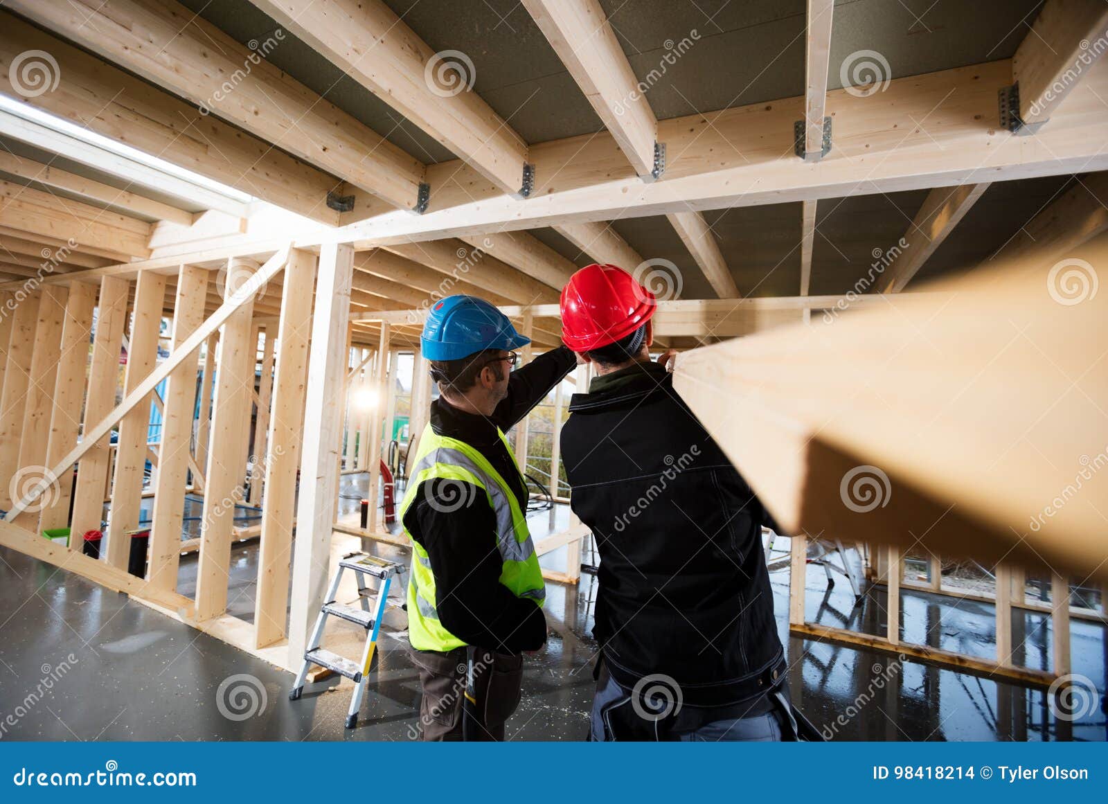 Carpenters Working at Construction Site Stock Photo - Image of jacket ...