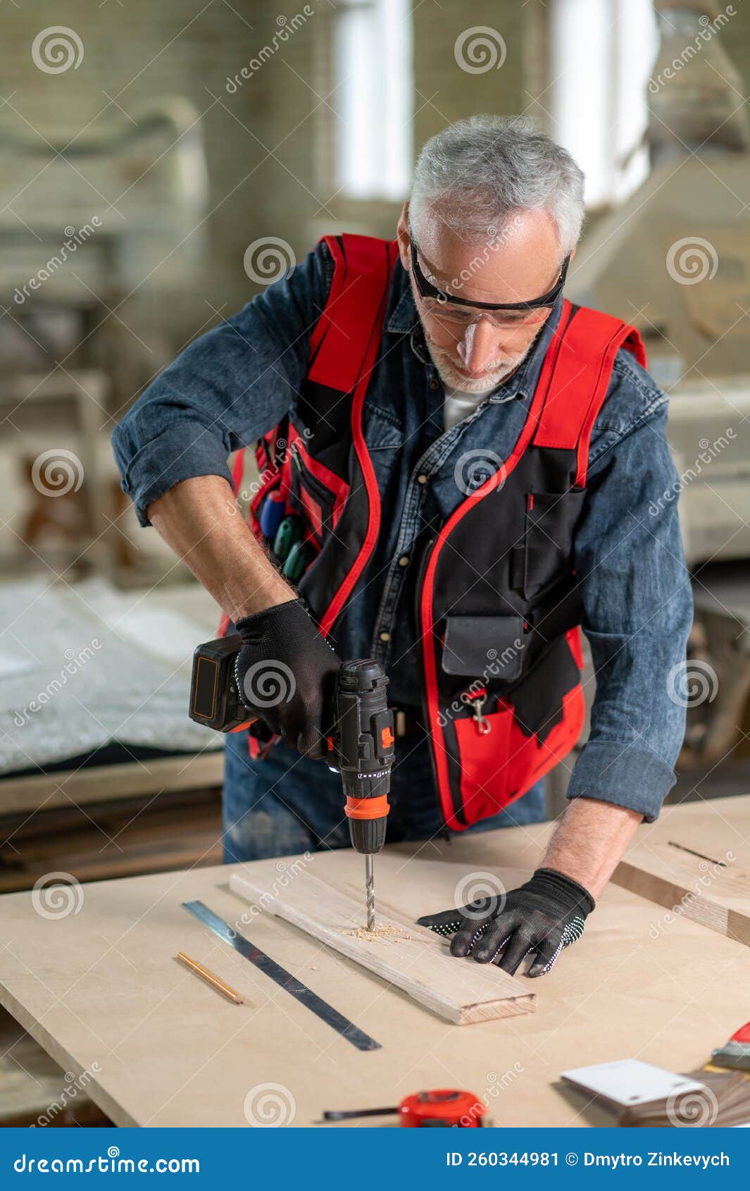 Craft Person Drlling Wood in the Workshop Stock Image - Image of vest ...