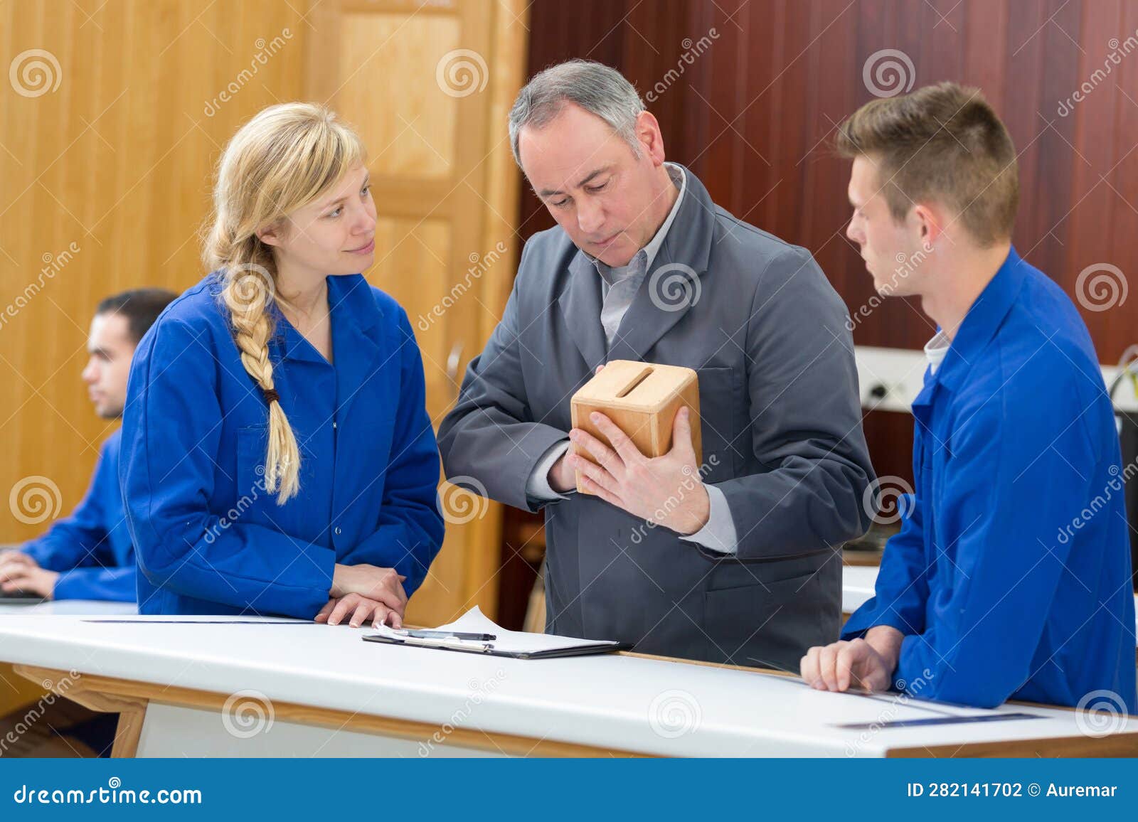 Carpentry Tutor Inspecting Box Students Have Made Stock Photo - Image ...