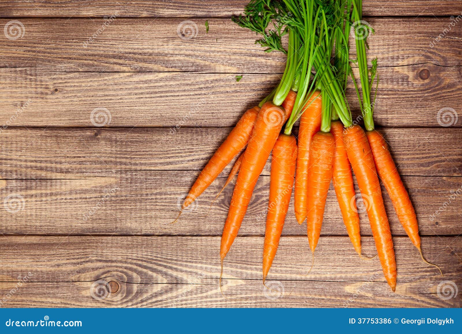 Carrot on a wooden table stock photo. Image of colorful - 37753386