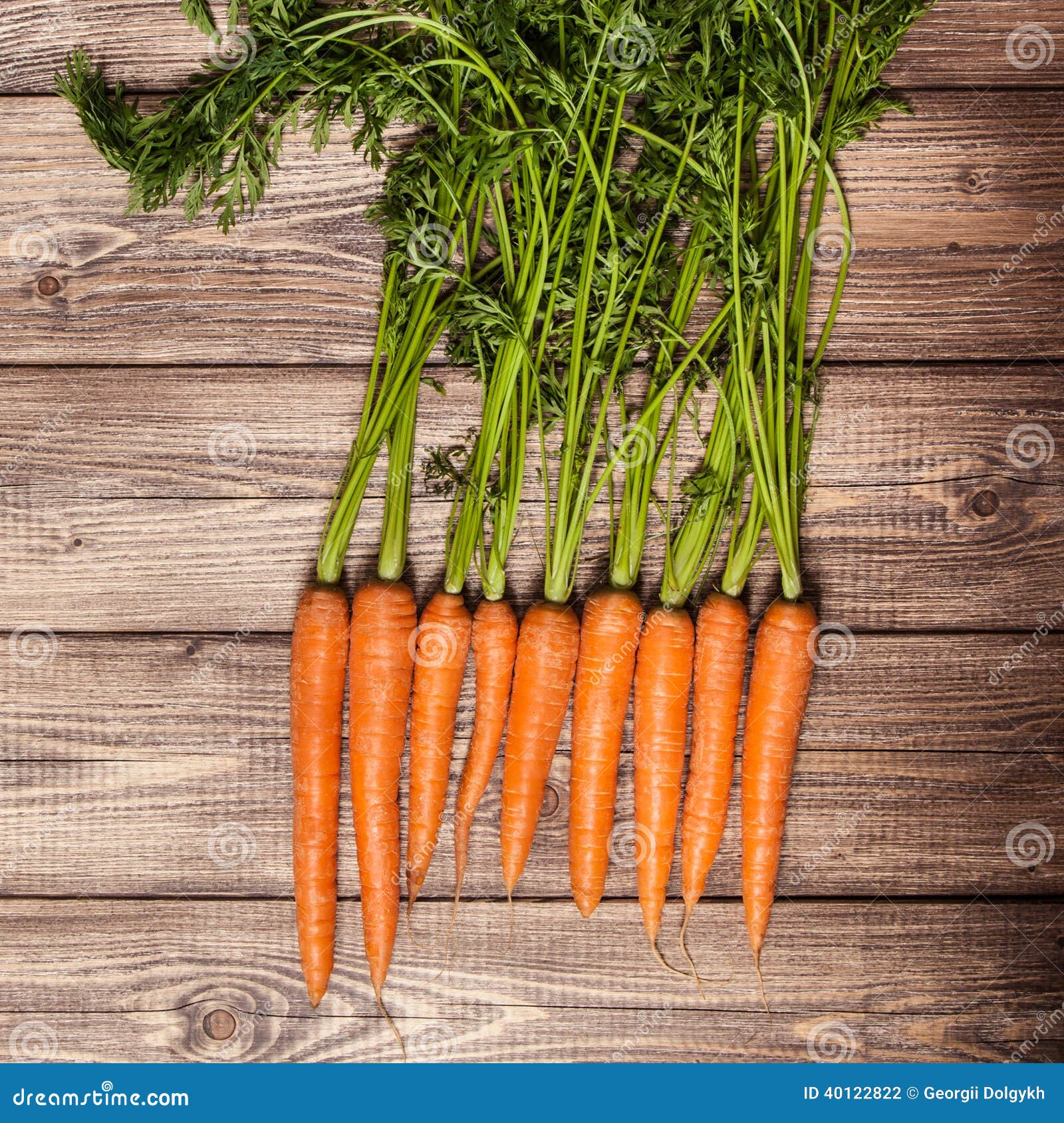Carrot on a wooden table stock photo. Image of orange - 40122822