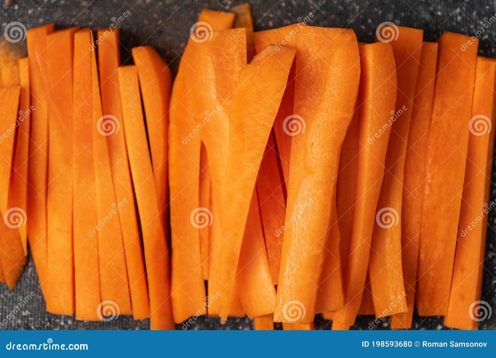 Carrots Cut into Strips Lying on a Gray Board Top View Stock Photo ...