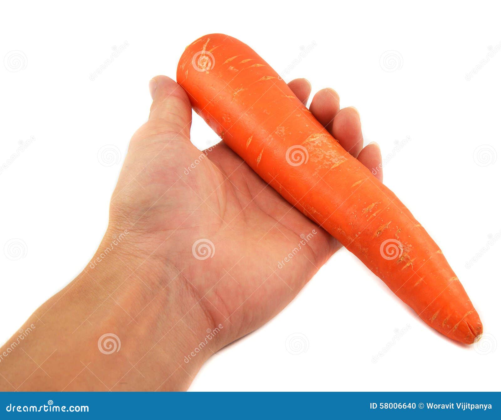 Carrots in hand stock photo. Image of healthy, carotin - 58006640