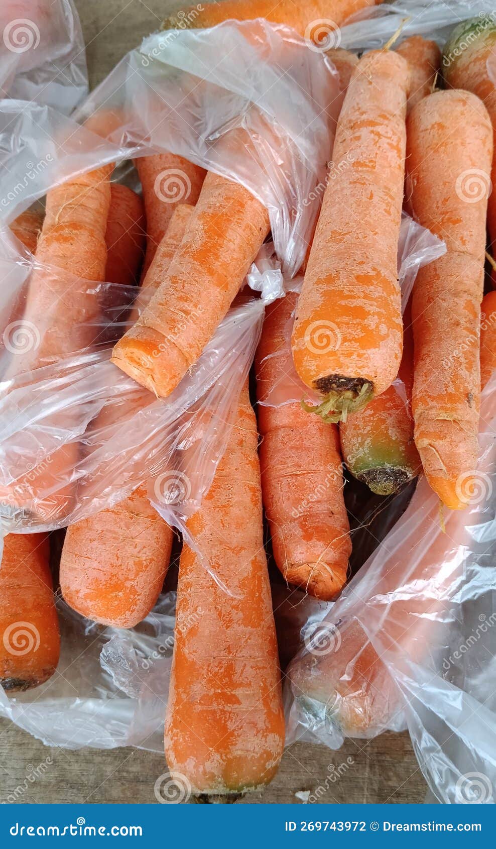 Carrots on the Market in Plastic Bags Stock Photo - Image of produce ...